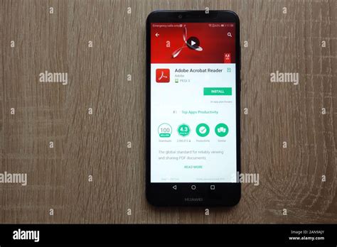 Adobe Acrobat Reader App On Google Play Store Website Displayed On A Modern Smartphone Stock