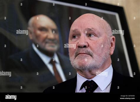 Former Stormont Speaker Alex Maskey In Front Of A Portrait Of Him By Belfast Artist Tony Bell