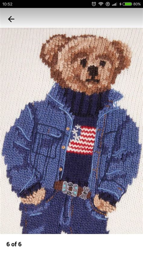 A Teddy Bear Wearing A Sweater And Jeans