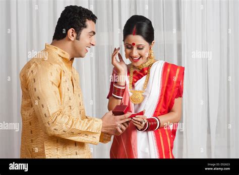 Woman Giving Gift To His Wife Stock Photo Alamy