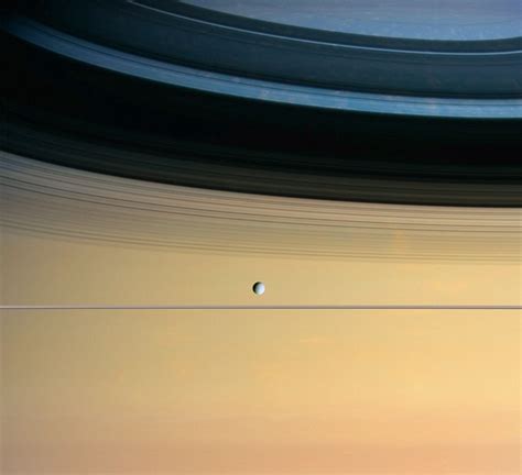 Spectacular View Of Saturns Moon Dione Captured As Cassini Probe