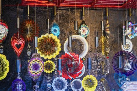 Hanging Colorful Metal Wind Spinners Displayed At Market Stall Concept