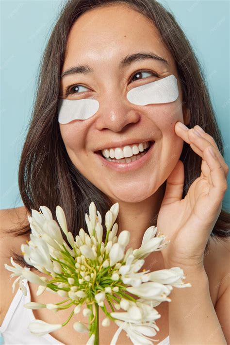 Premium Photo Close Up Shot Of Cheerful Dark Haired Woman Touches