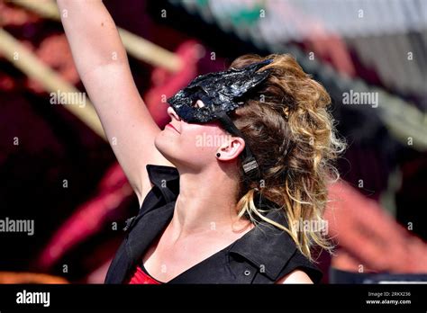 Young Woman Performs Her Music And Dance Act On A Float During Flower