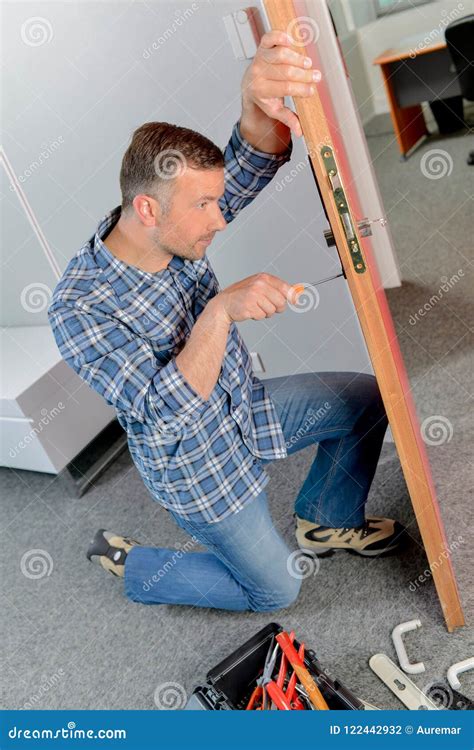Man Fixing Lock To Interior Door Stock Photo Image Of Workman Intervention