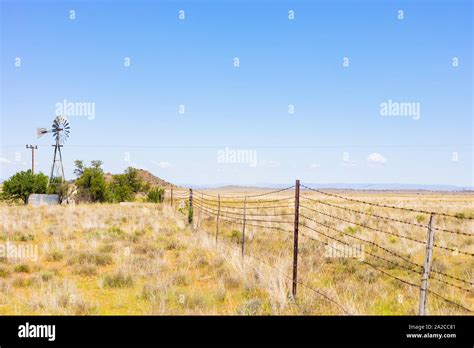 Windmill Windpump On A Farm In Rural Grassland Area Of South Africa