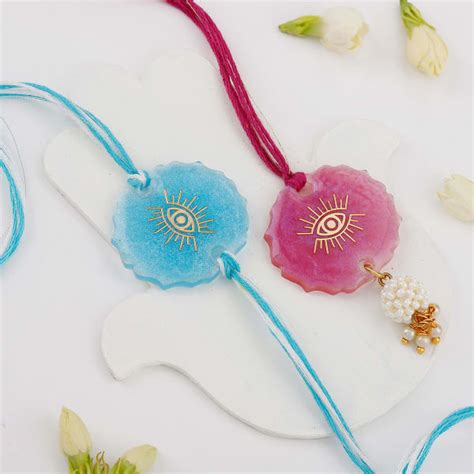Buysend Evil Eye Bhaiya Bhabhi Resin Rakhi Set Online Igp Jvs1240870