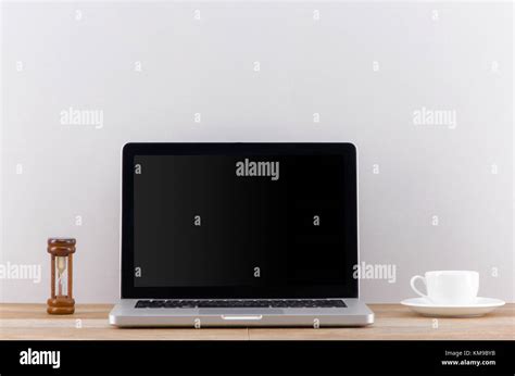 Laptop Computer White Blank Screen On Work Table Front View Stock Photo