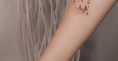Fine Line Hourglass Tattoo Done On The Inner Forearm