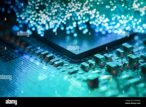 Macro Photograph Of A Printed Circuit Board With A Processor And Optical Fibers Illuminating The
