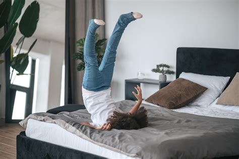 Premium Photo Enjoyed A Cute Curly Haired Girl Having Fun And Looking Enjoyed