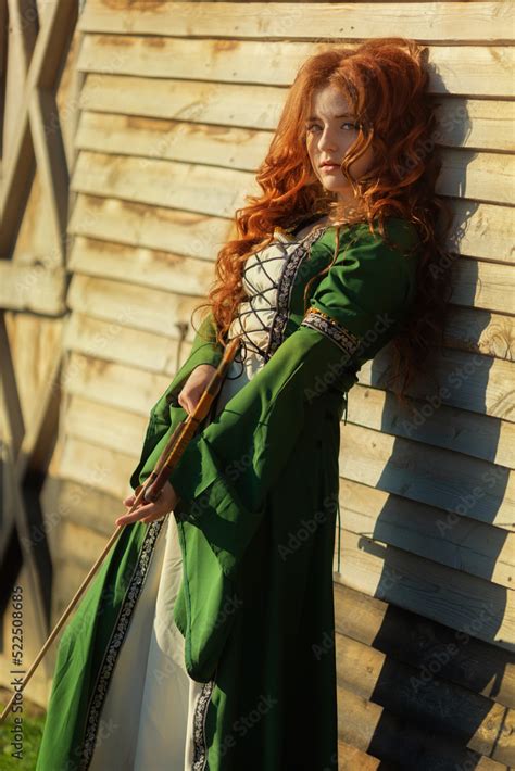 Mysterious Red Haired Warrior Girl Stands Lady Elven Princess Holds Bow And Arrow Long