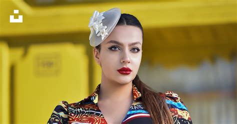 Woman In White And Red Floral Long Sleeve Shirt Wearing White Floral