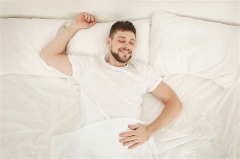 Premium Photo Young Attractive Man Sleeping In Bed At Home