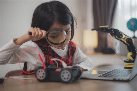 STEM Education Concept Asian Students Learn At Home By Coding Robot