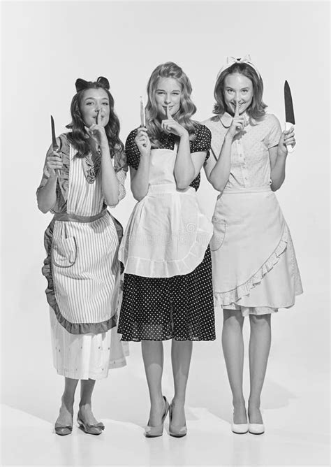 Retro Style Portrait Of Beautiful Young Women Housewives With Cooking