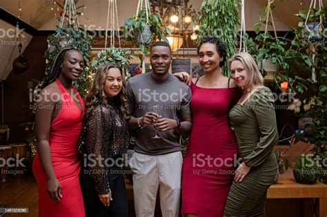 Black Man With Group Of Beautiful Women At A Dinner Party Celebration