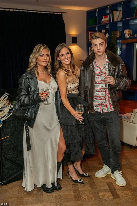 Megan Barton Hanson Dazzles In Satin Silver Dress With A Daring Slit At