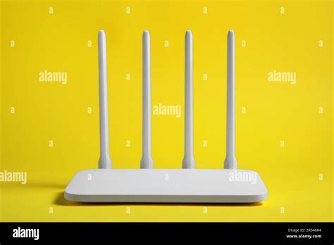 New White Wi Fi Router On Yellow Background Stock Photo Alamy