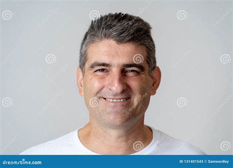 Close Up Portrait Of An Attractive Middle Aged Man Having Fun And