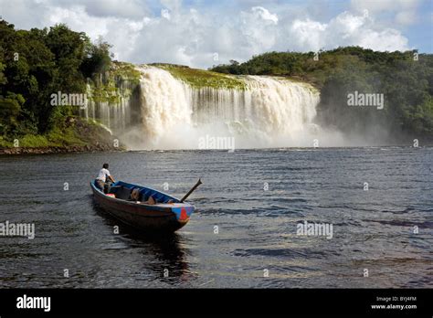 A Pemon Tribe Man While Sailing With His Boat At Canaima Lake Just In