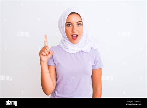 Young Beautiful Arabian Girl Wearing Hijab Standing Over Isolated White