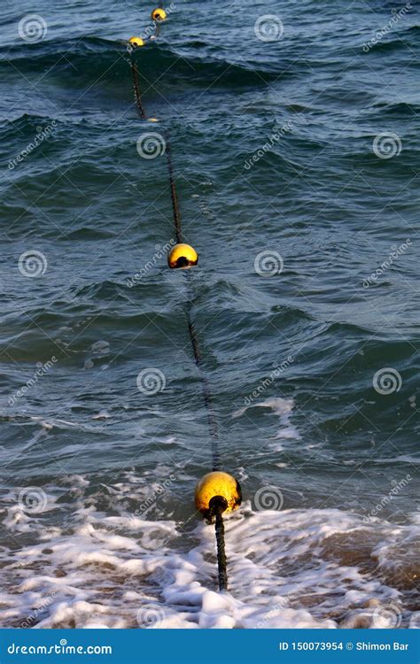 Rope With Floats On The Beach On The Shores Of The Mediterranean Sea