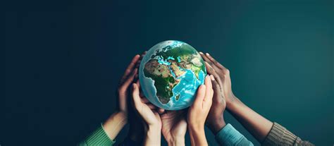Hands Holding Earth Globe On Blue Background Symbolizing International