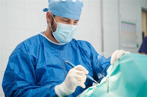 Premium Photo Surgeon Making An Incision With An Electro Scalpel For