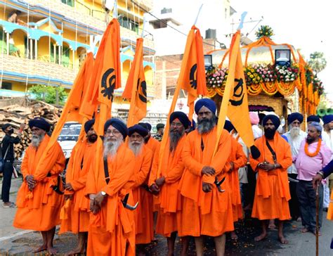 Sikh Devotees Take Part In A Nagar Kirtan Procession On The Eve Of