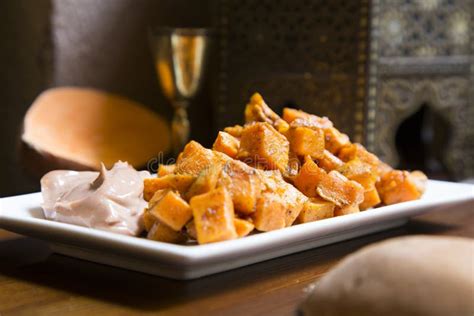 Roasted Sweet Potato With Spice Sauce In A Lebanese Restaurant Stock