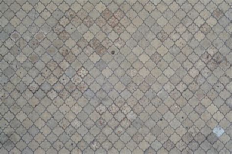 The Texture Of A Rhythmic Mosaic Made Of Concrete Tiles Background Image Of A Large Area Of Old