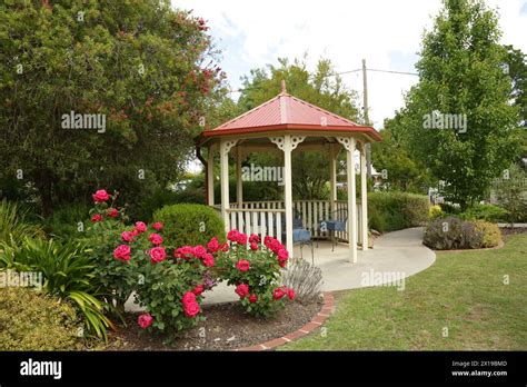 Pretty Garden Scene Featuring Wooden Gazebo Rose Garden Lawn And