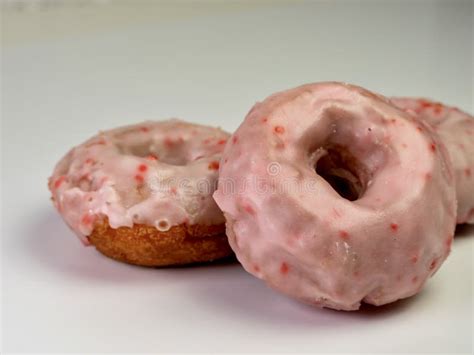 Cherry Doughnut Donut With Pink Cherry Glaze On Top Piled Up On A White Counter Delicious