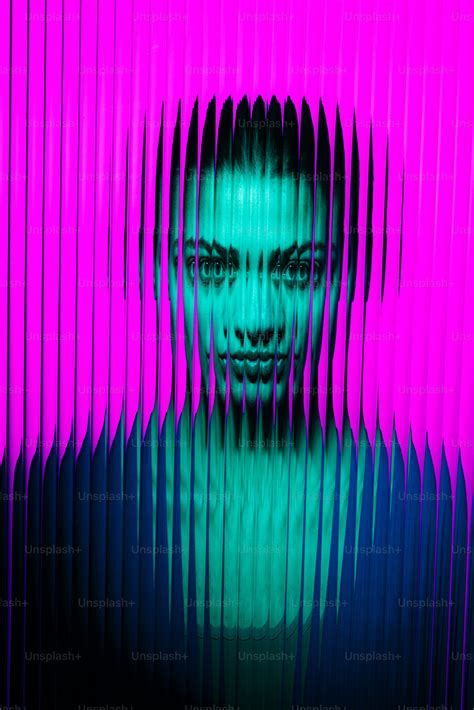 A Womans Face Appears Through Pink Vertical Lines Photo Wallpaper Image On Unsplash