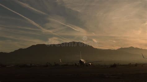 Airplane In The Airport Runway Positioning To Taking Off At Sunset Stock Footage Video Of