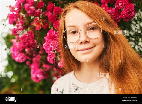 Outdoor Close Up Portrait Of Happy Young Girl Wearing Eyeglasses