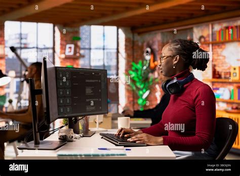 Startup Employee Using Large Language Model Application To Get Help With Coding Tasks Woman