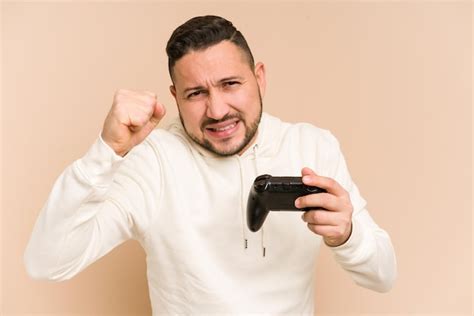 Premium Photo Adult Latin Man Playing With A Game Controller Isolated