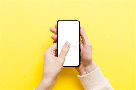 Top View Of Woman Hands Holding Smart Phone With Blank Copy Space