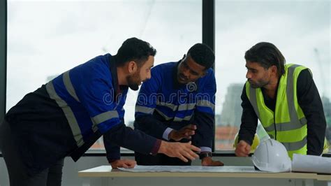 Engineers Using Blueprint Of Project Plan Brainstorming And Working