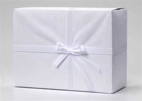 Two White Boxes With Bows Premium Ai Generated Image