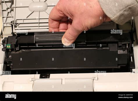 A Man Changes A Toner Cartridge In A Laser Printer Stock Photo Alamy