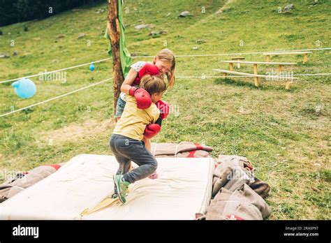 Big Sister And Small Brother Having A Fight Of A Handmade Boxing Ring