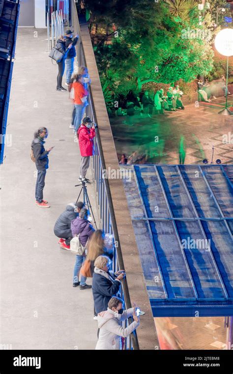 Photographers With Cameras And Phones Line Up Along The Railway