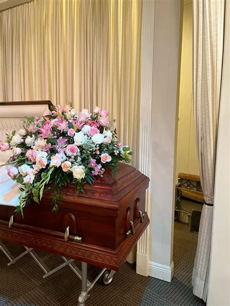 Casket With Flowers On Top Pink Casket Interior Funeral Service In