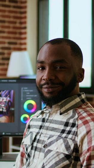 Vertical Male Filmmaker Editing Montage On Professional Software Doing Freelance Work For A