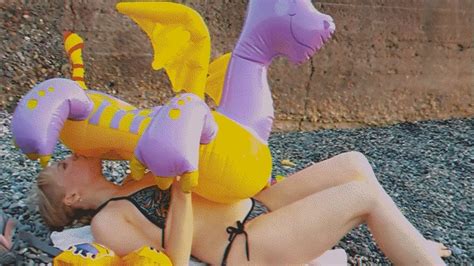Alla Inflates A Rare Inflatable Magic Dragon With Her Mouth And Floats