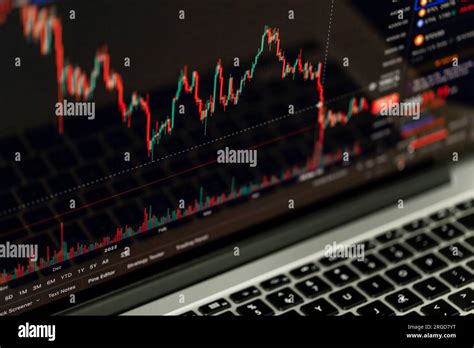 Trading Chart Displayed On The Screen Of The Laptop Stock Market