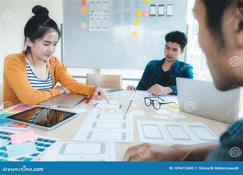 Programmer And Web Designer Ux Ui Meeting For Planing Mobile Ap Stock
